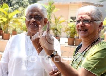 Fotocorp : Pyarelal Sharma, Sunila Sharma Voting begins for Lok sabha ...